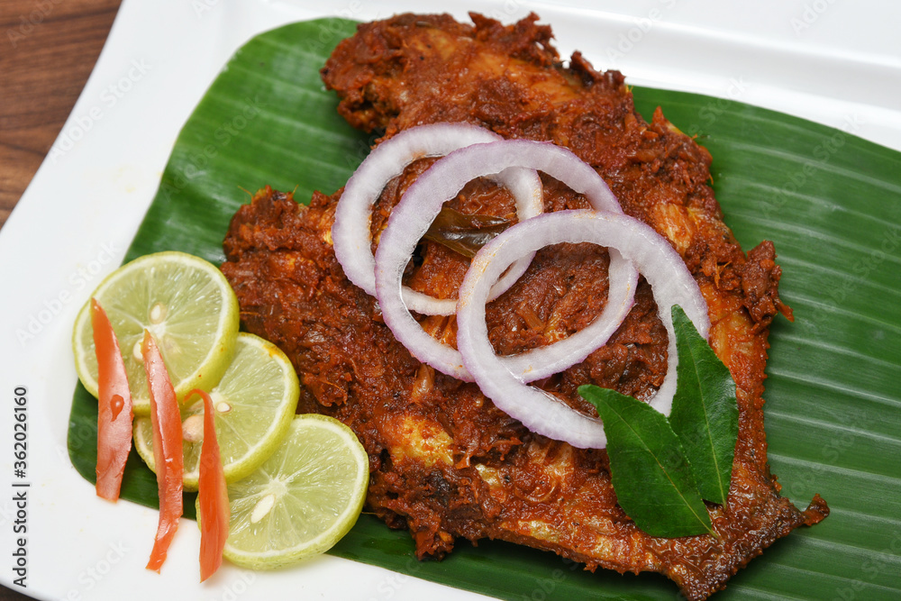 Kerala fish curry, Karimeen Pollichathu a popular hot and spicy baked ...