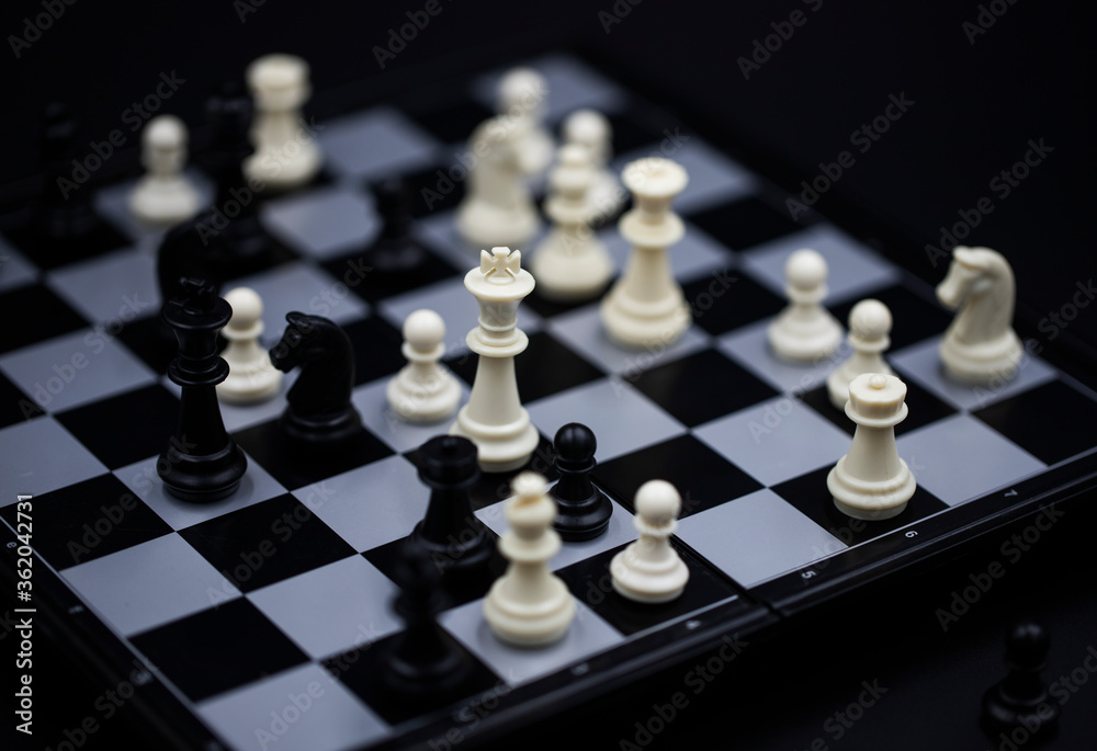 White king in chess game on chessboard. Black and white figure ...