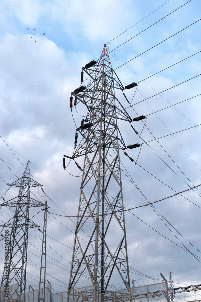 High voltage power transmission tower. Power tower with cloud ...