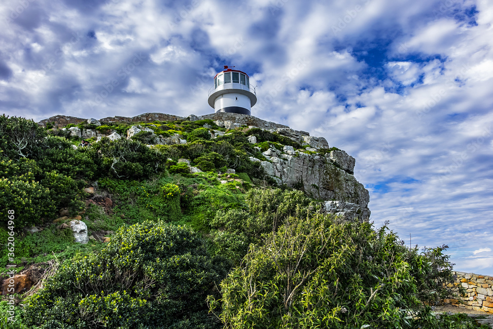 Old lighthouse (1857) sits on top of cliffs of Cape Point in Cape of ...