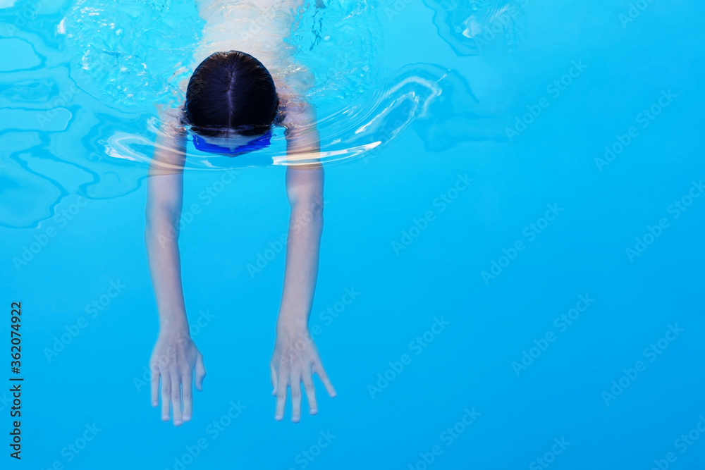 Athlete swimmer swims underwater, top view. Healthy lifestyle and sport ...