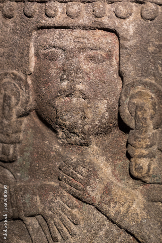 Full frame vertical close-up of Mexica carved stone sculpture of Aztec ...