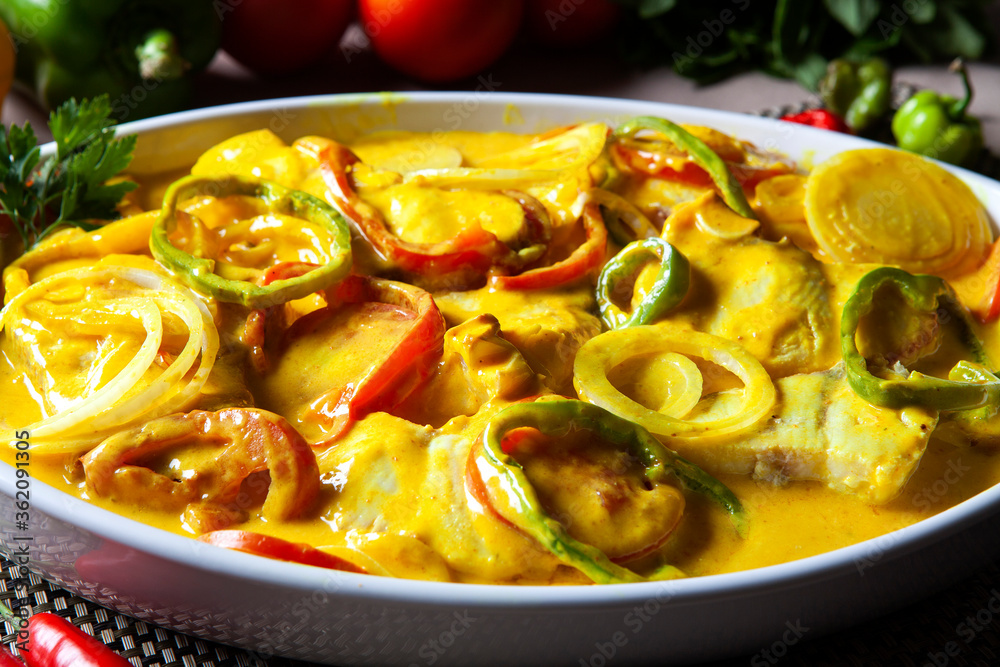 Traditional Brazilian dish called Moqueca de peixe. Cod Fish on white ...