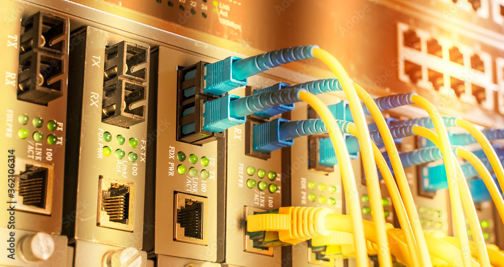 Fiber Optic cables connected to optic ports and UTP, Network cables ...