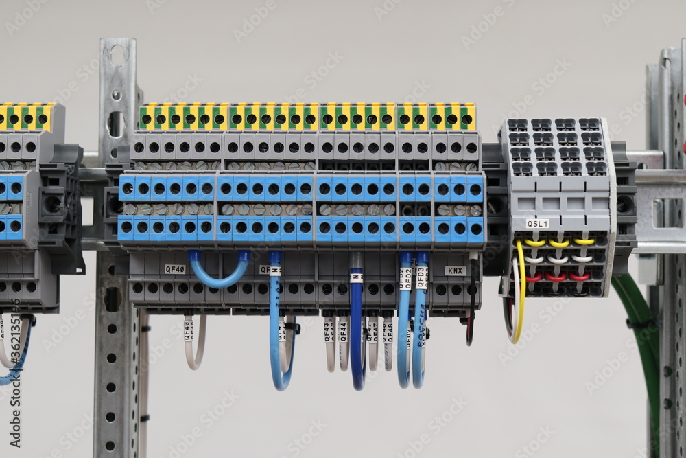Pass-through electrical terminals for connecting wires in electrical ...