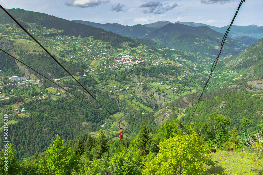 Red ropeway in Khulo, Georgia. Cable car from Khulo to Tago village ...