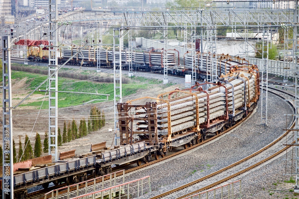 Freight train transports railway elements. Modern railways ...