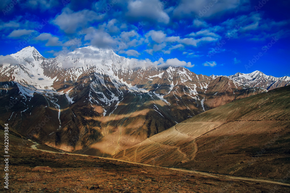 Himalayan valley landscape with road near Kunzum La pass, Spiti Valley ...