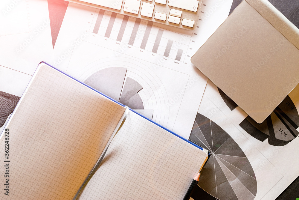 Notebook paper, Diagrams graphs and financial documents Finance concept ...