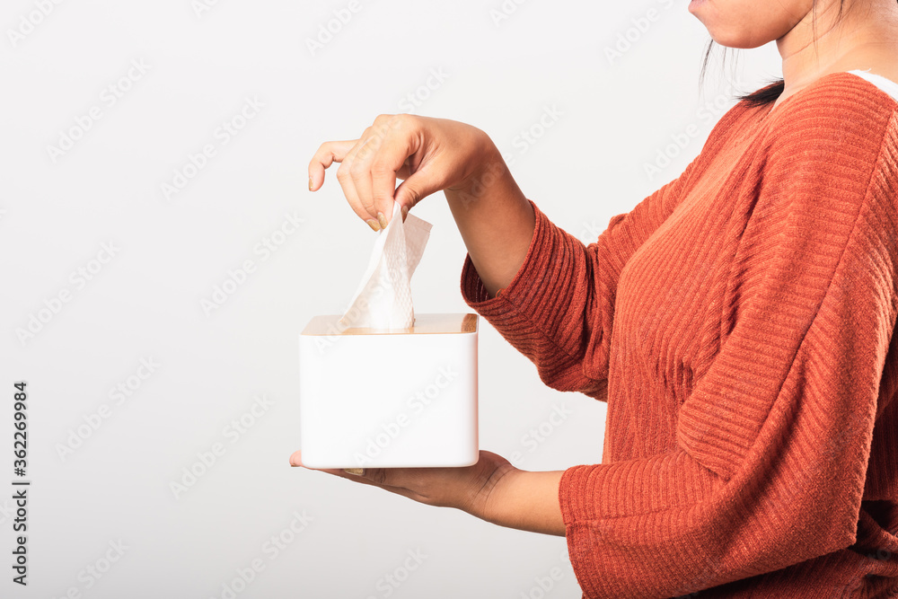 Young woman flu she using hand taking pulling white facial tissue out ...