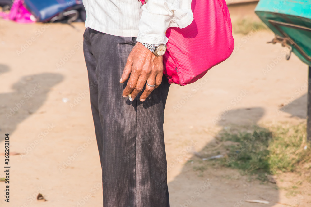 Image of a person smoking Indian local beedi Stock Photo | Adobe Stock