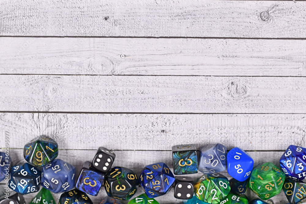 Roleplay game background with different blue and green RPG dices at ...