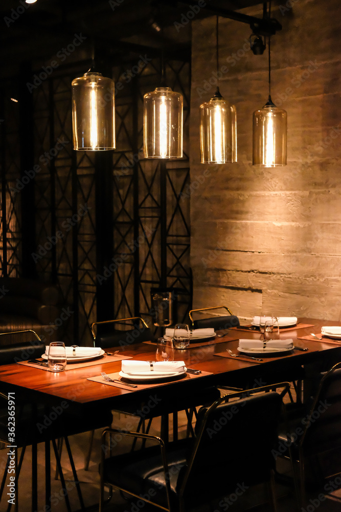 Seating inside the restaurant at night Stock Photo | Adobe Stock