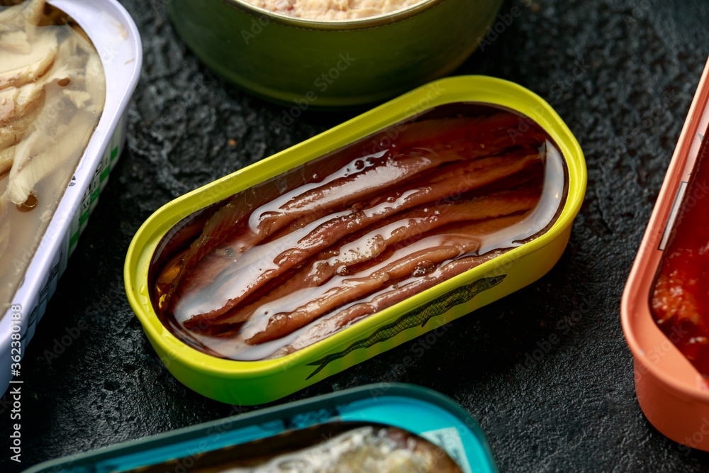 Canned fish with different assortment types of seafood on rustic stone ...