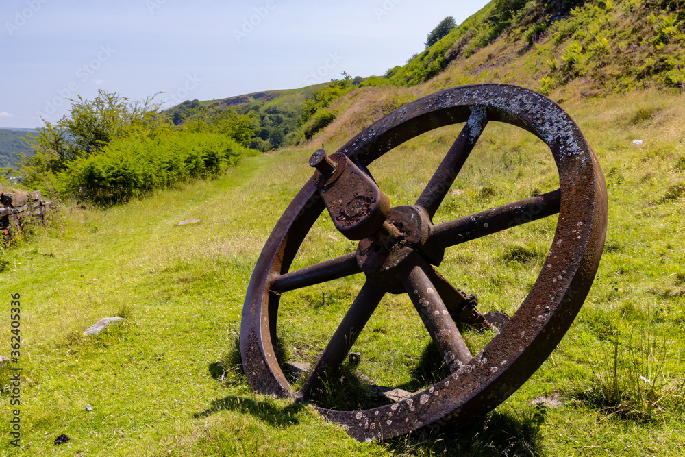 Huge, rusting abandoned flywheel from a Victorian era lifting engine ...