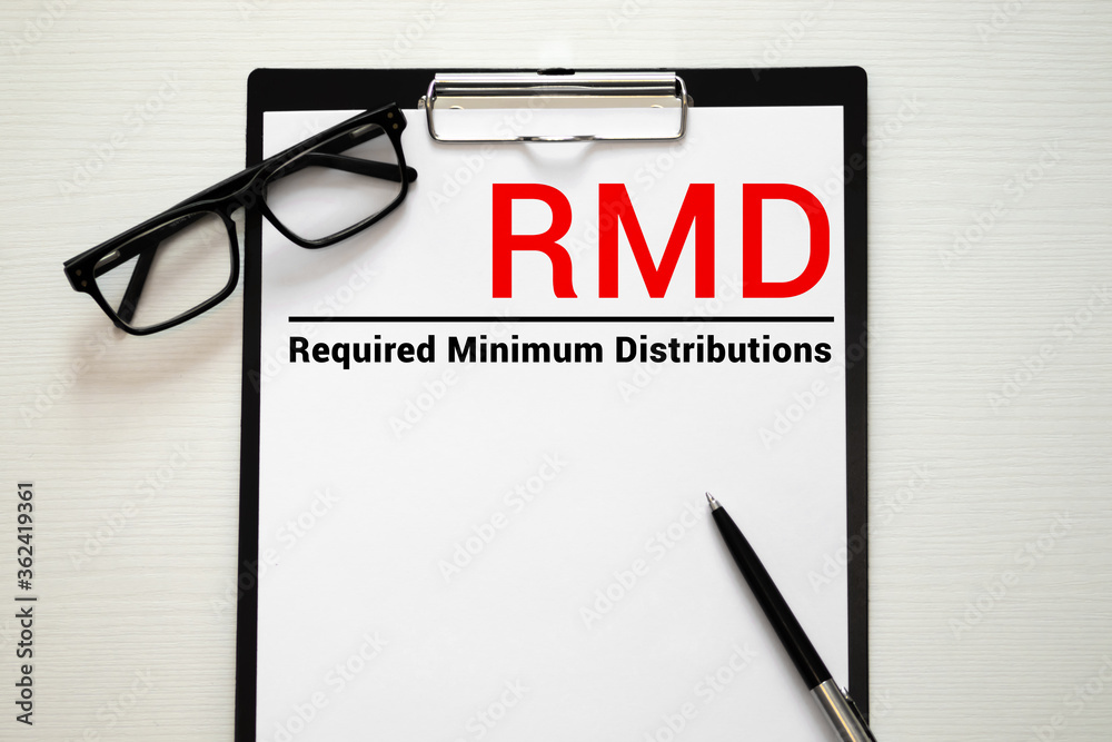 Paper with Required Minimum Distributions RMD on a table Stock Photo ...