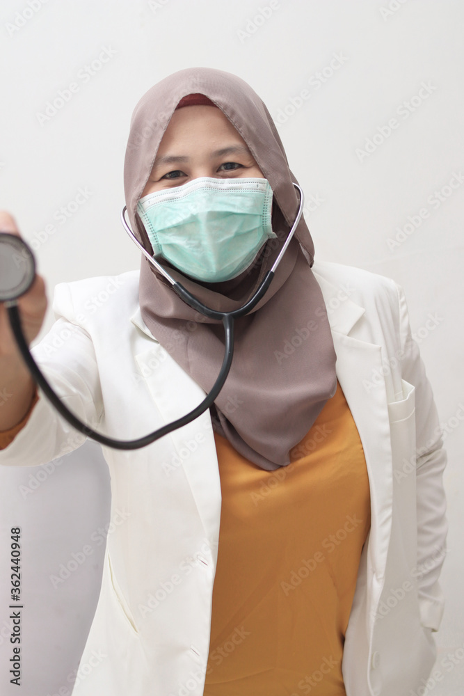 Beautiful Asian muslim female medical doctor wearing hijab and ...