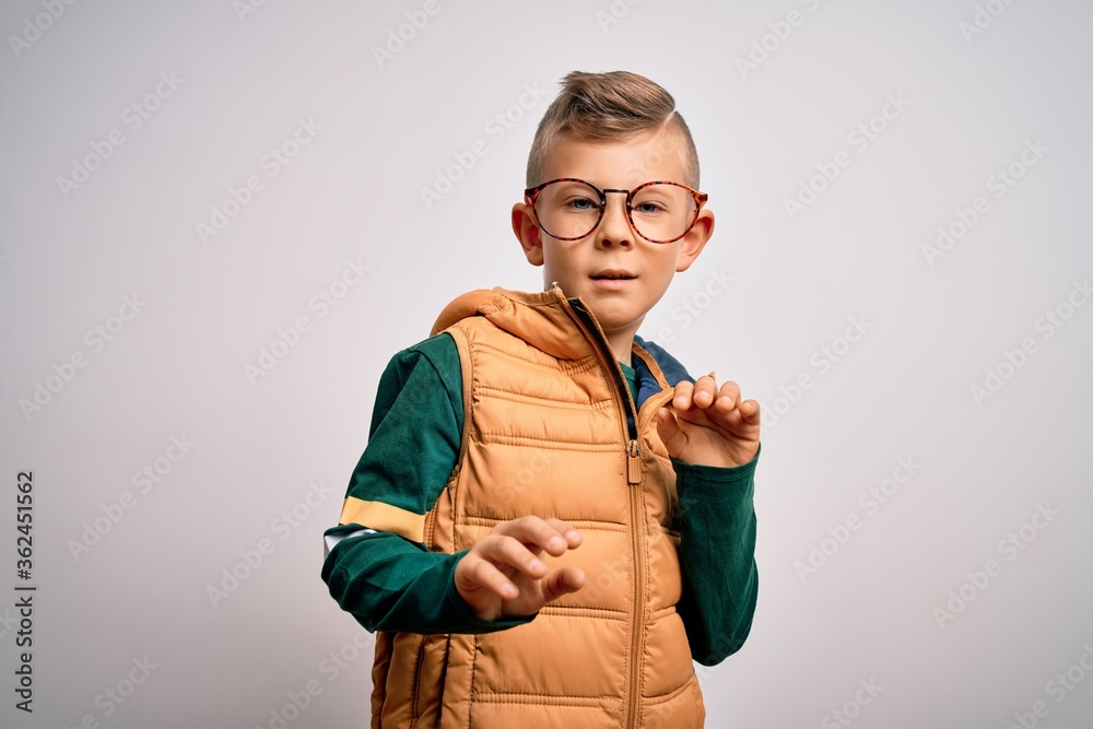 Young little caucasian kid with blue eyes wearing winter coat and smart ...