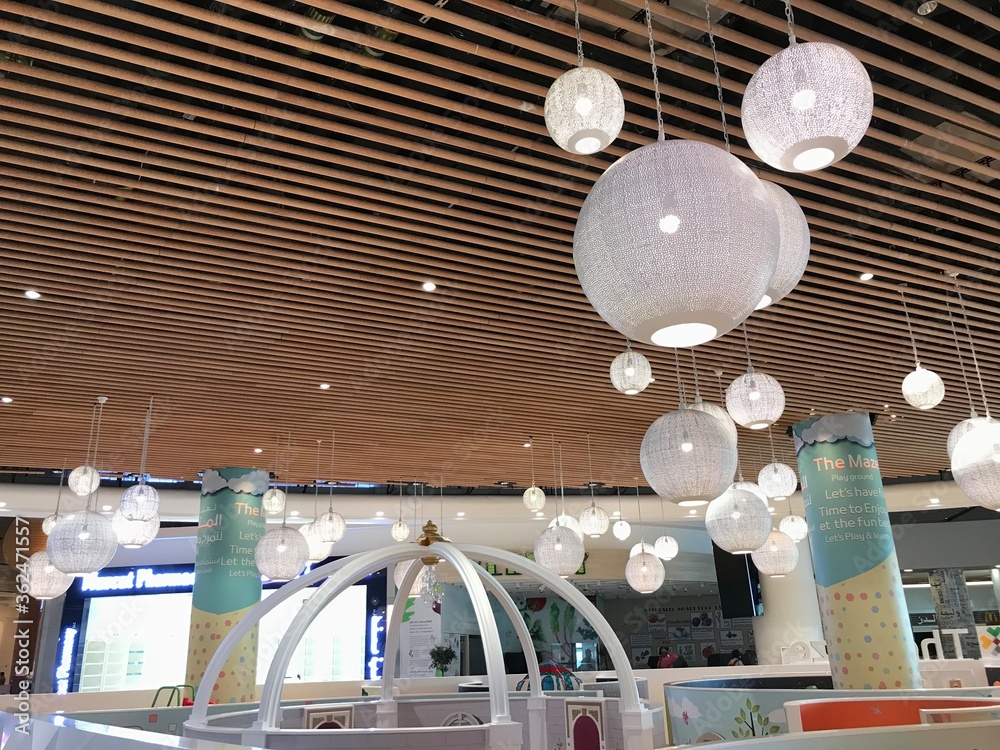 Wooden rafter suspended false ceiling interiors for an shopping ...