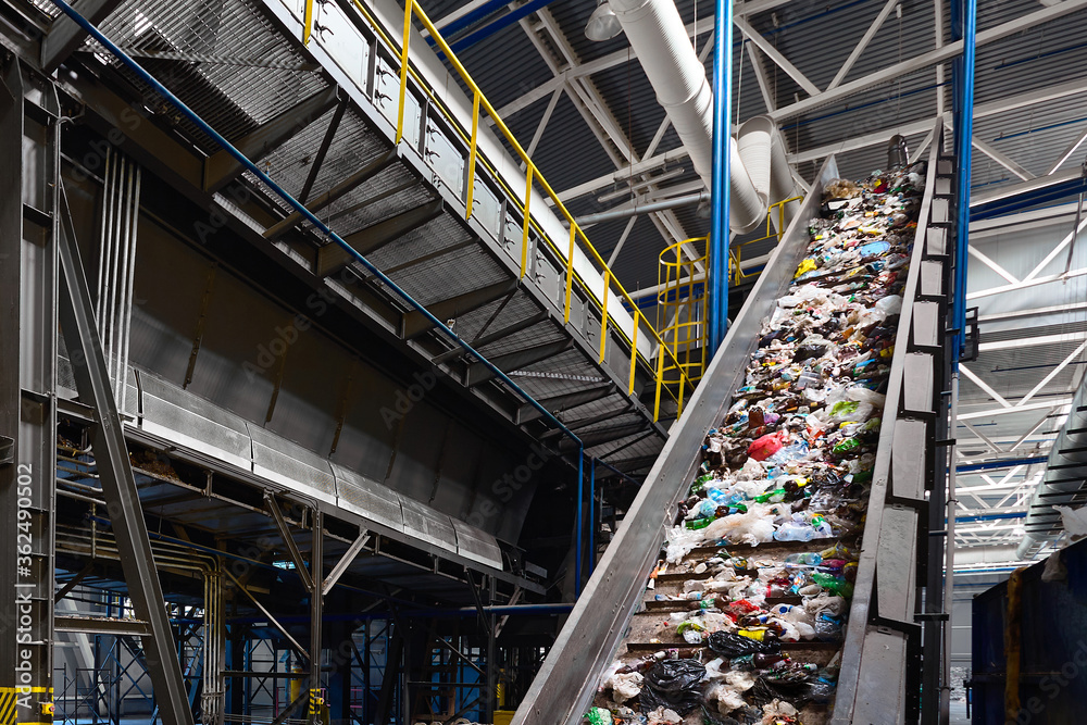 Conveyor belt with garbage transports waste inside drum filter or ...