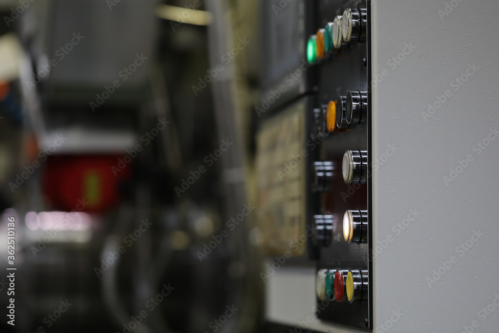 Close up of electrical panel and stop botton switch in control room ...