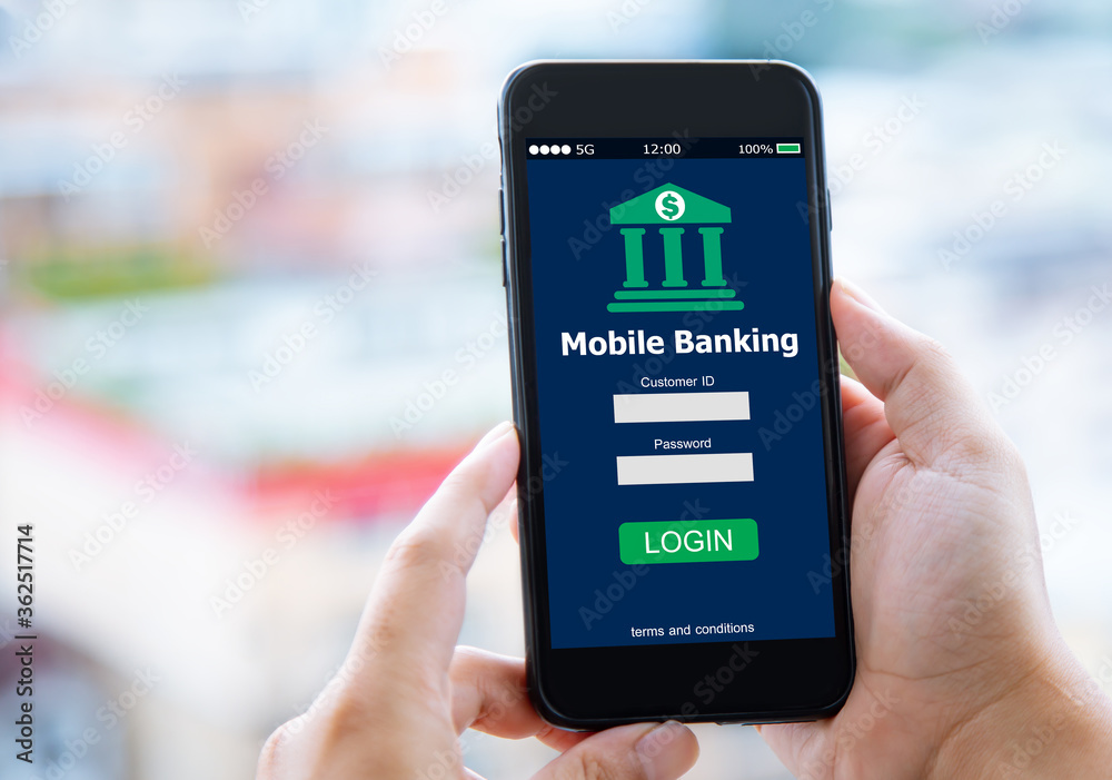 Mobile Banking concept.Man hands holding mobile phone on blurred urban ...