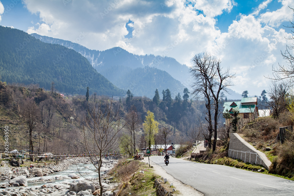 Beautiful landscape with road between the cities of Kullu and Manali ...