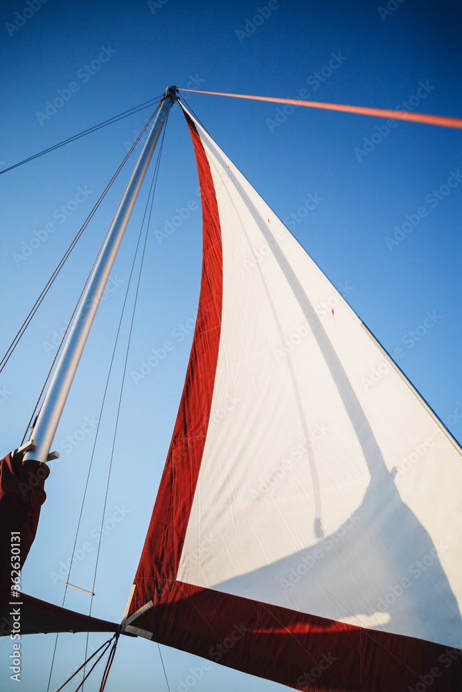 Top of the sailboat, mast head, sail and nautical rope yacht detail ...