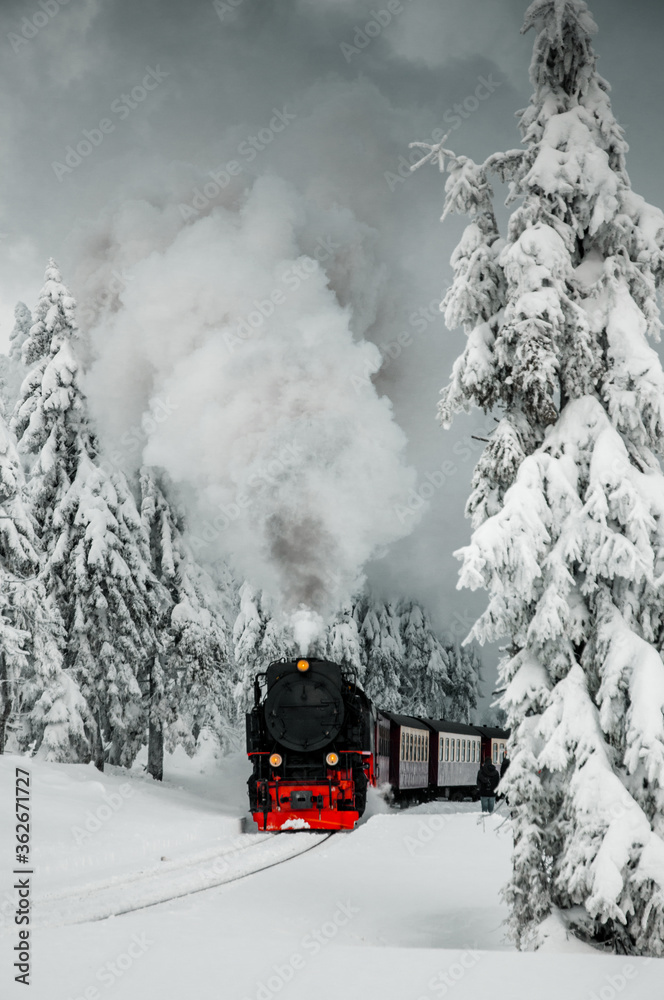 Zdjęcie Stock: Historic steam train in the winter mountain landscape ...