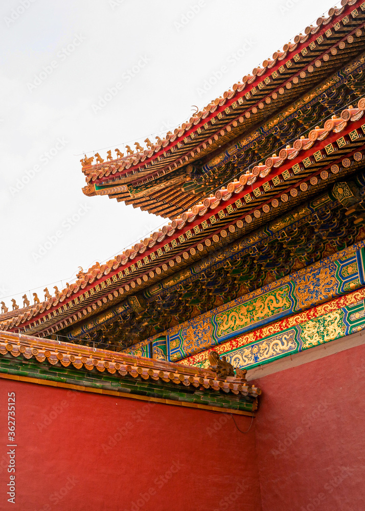 Roof detail of Chinese building showing colorful shingle tiles and side ...