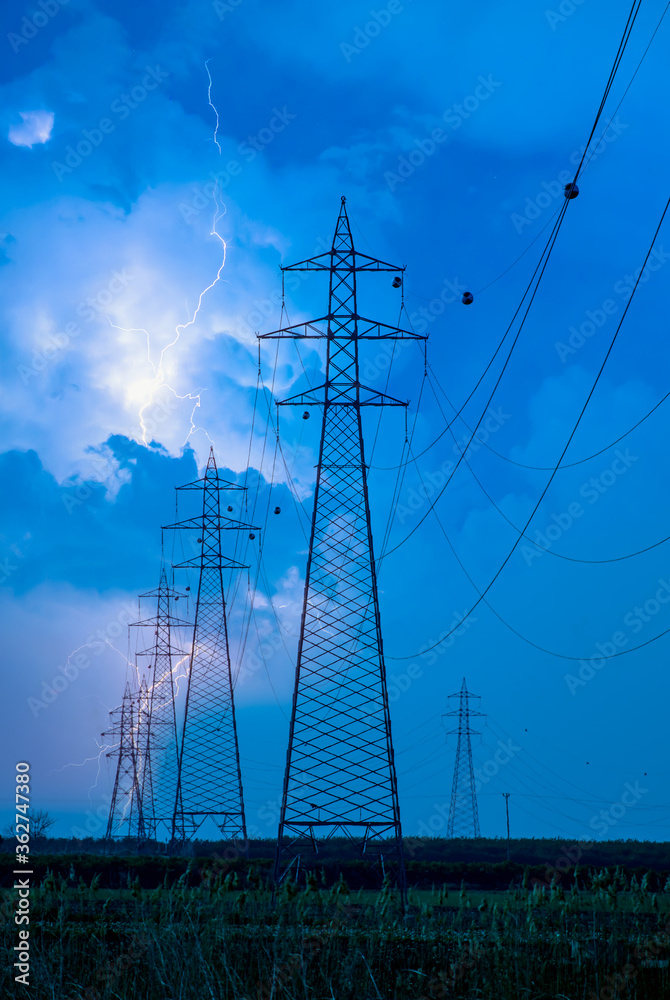 High voltage power lines with aamazing lightning Stock Photo | Adobe Stock