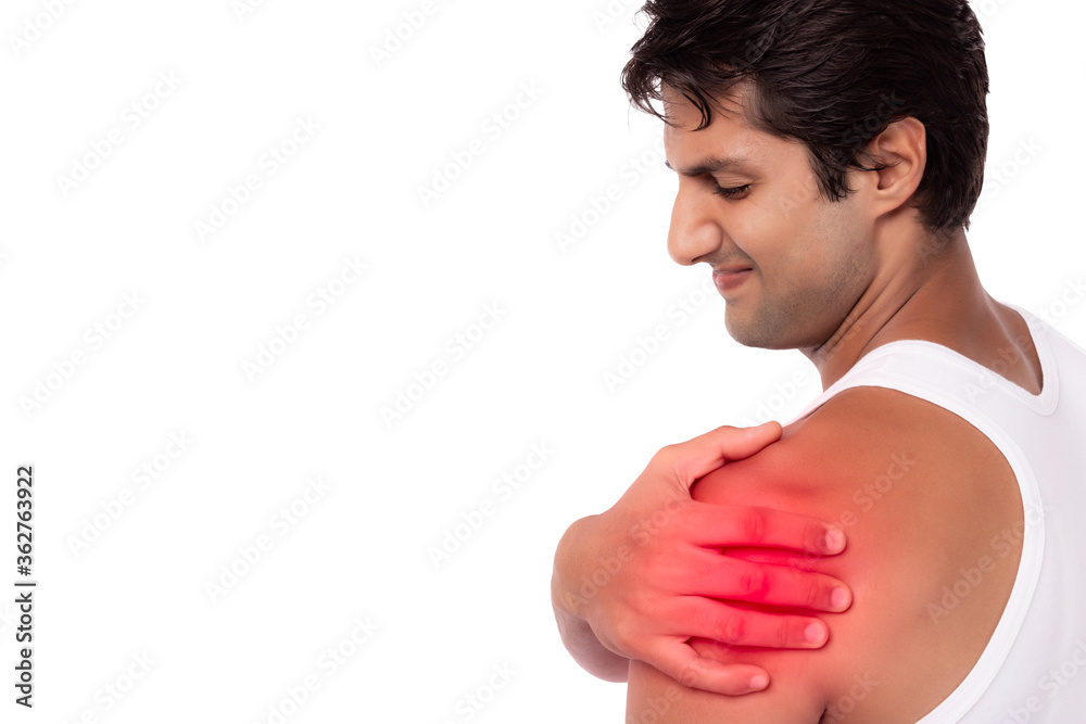 Young man get hurt, pain and suffering in shoulder, touching his ...