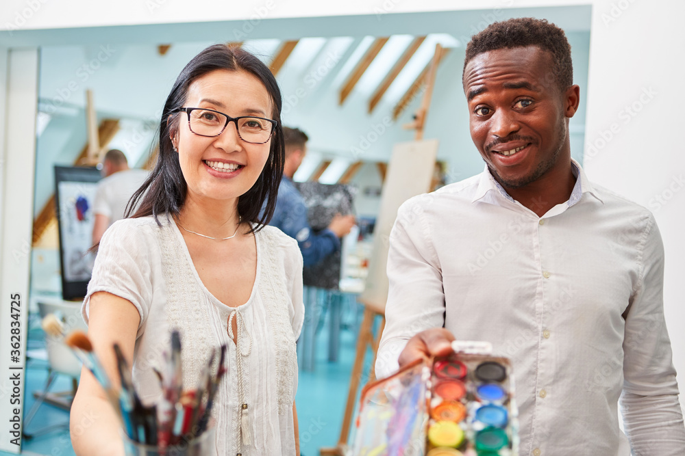 Artist couple with paintbrush and inkbox Stock Photo | Adobe Stock