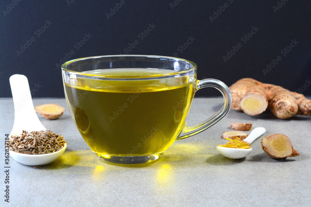 Cumin tea also known Jeera tea or Jeera water in a glass cup with cumin ...