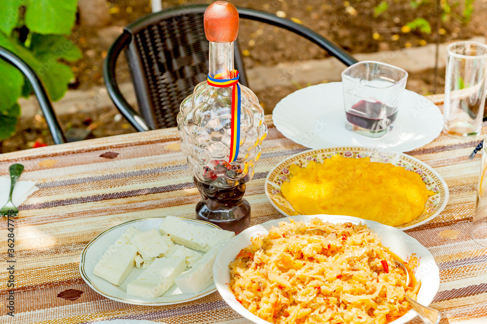 traditional romanian meal: polenta, cooked cabbage maturated cheese and ...