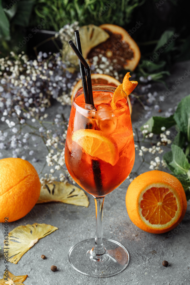 Aperol spritz cocktail on a gray concrete background. a glass of aperol ...