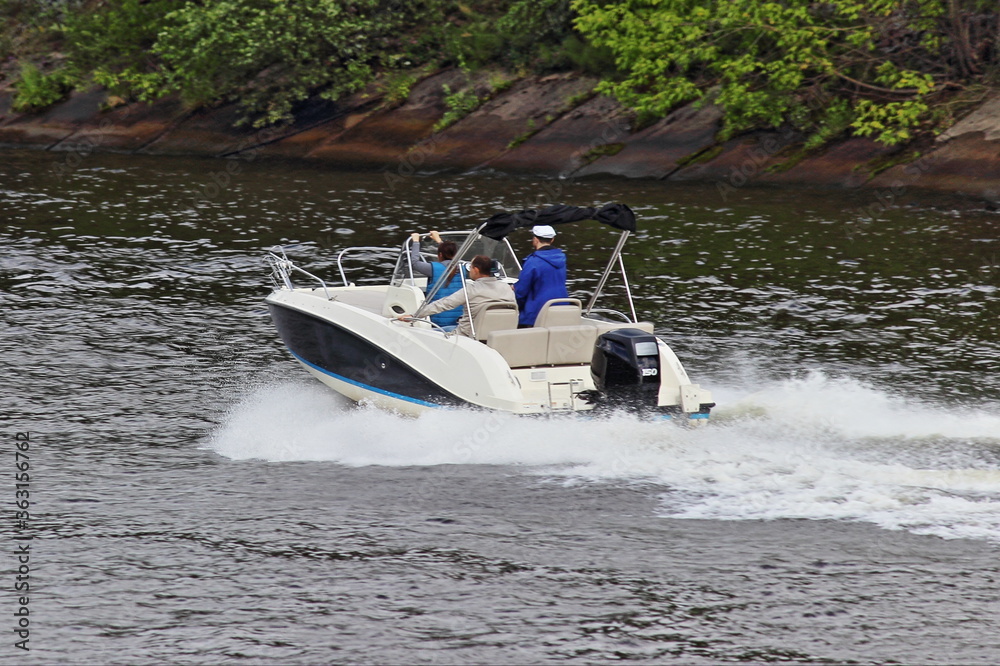 Modern open bowrider motor boat with 150 hp powerful outboard motor ...