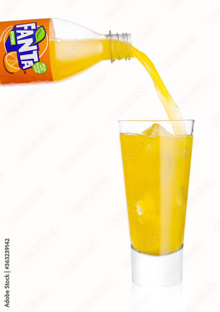 LONDON, UK - JANUARY 20, 2018: Pouring Fanta soft drink from bottle to ...