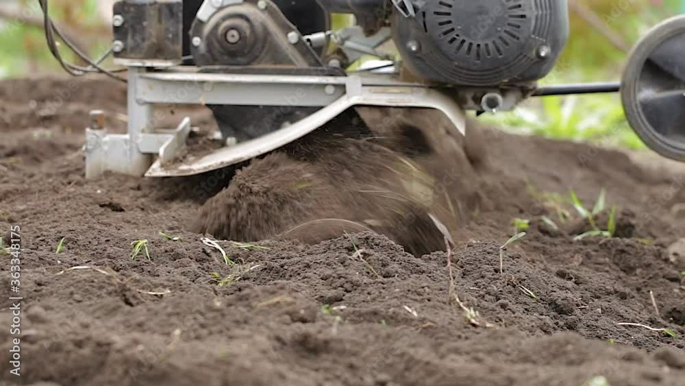 Video „Man farmer working in field ploughing the land with a plough on ...
