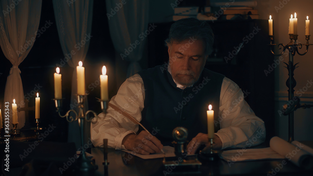 man in the 18th century writing at his desk using a quill pen ภาพถ่าย ...