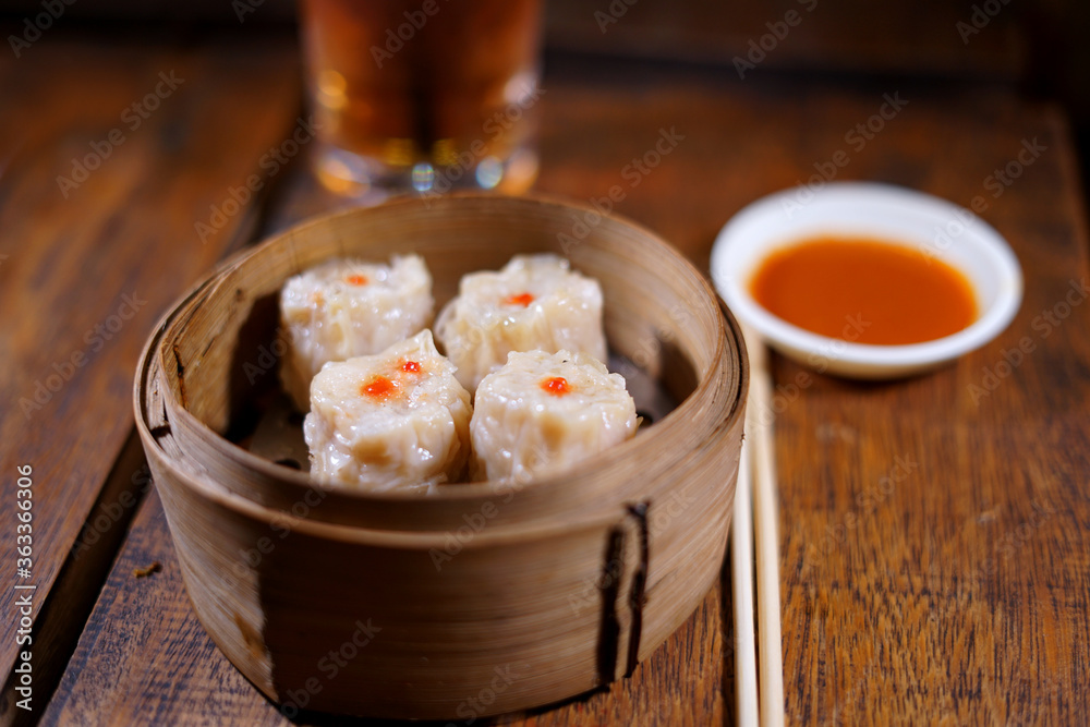 Steamed Dumplings Dim Sum On Wooden Table Stock Photo | Adobe Stock