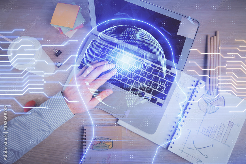 Double exposure of man's hands typing over computer keyboard and brain ...