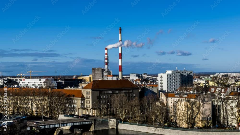 Cloud factory. Time lapse footage, with two, tall chimneys of power ...