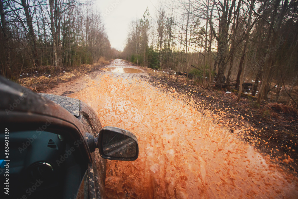 Suv offroad 4wd car rides through muddy puddle, off-road track road ...