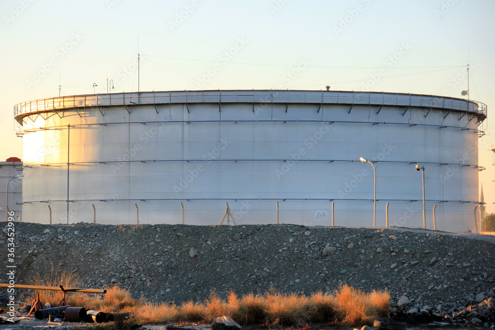View of the big oil storage tank with floating roof. Storage tanks are ...
