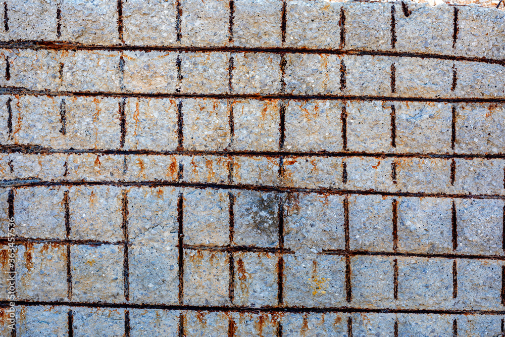 Poster Full frame view of the degraded concrete and rusted, exposed ...