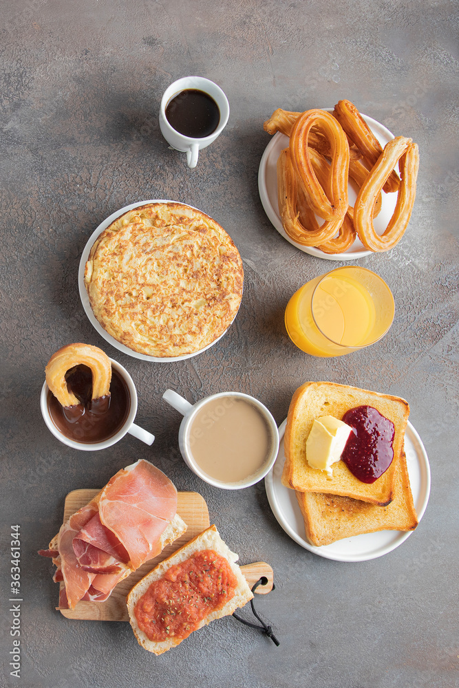 Typical Spanish breakfast concept. Tortilla, bruschetta with jamon and ...