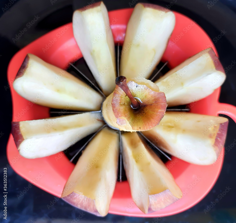 Apple shown beautifully in apple cutter like flower shape and it tempts ...