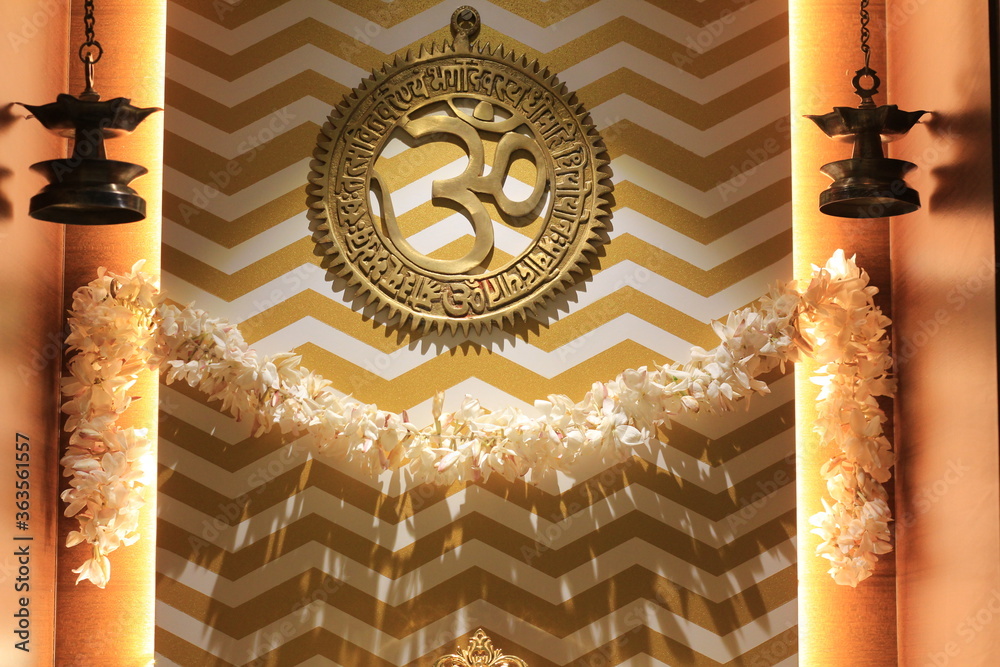 Om wall art used as background for temple inside the house Stock Photo ...