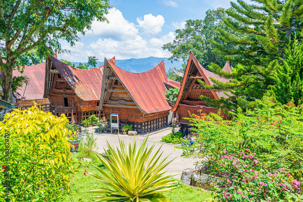 Batak traditional houses in a row at Ambarita village, lake Toba ...